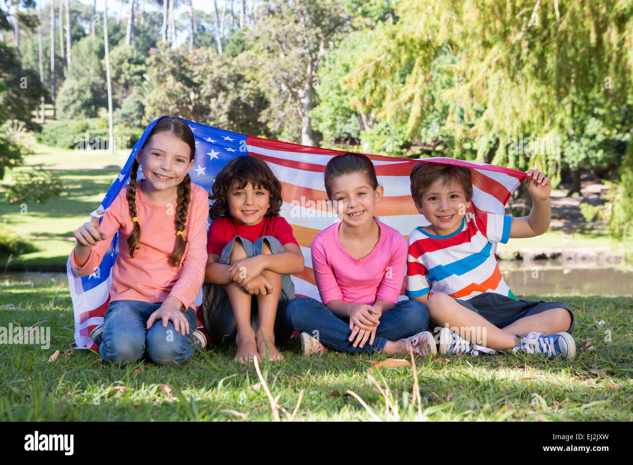 Happy little friends with american flag Stock Photo - Alamy