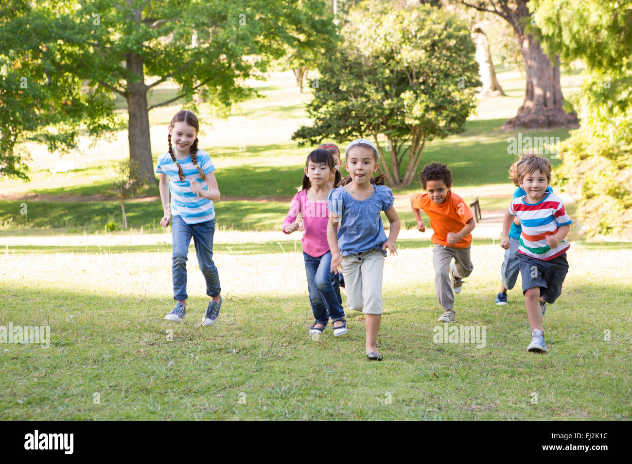 Children racing in the park Stock Photo - Alamy