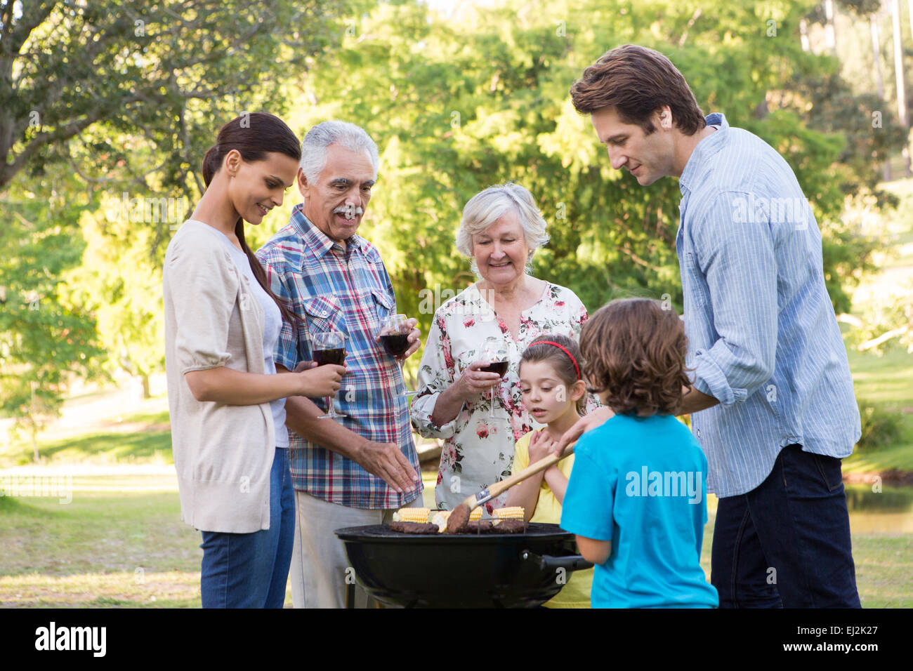 Family having barbecue hi-res stock photography and images - Alamy