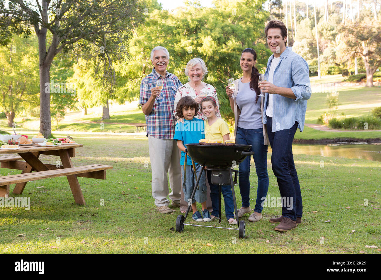 Family having barbecue hi-res stock photography and images - Alamy