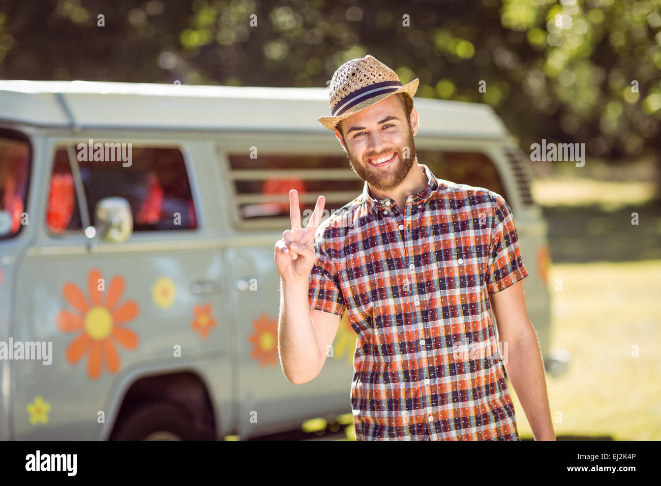 Handsome hipster smiling at camera Stock Photo - Alamy