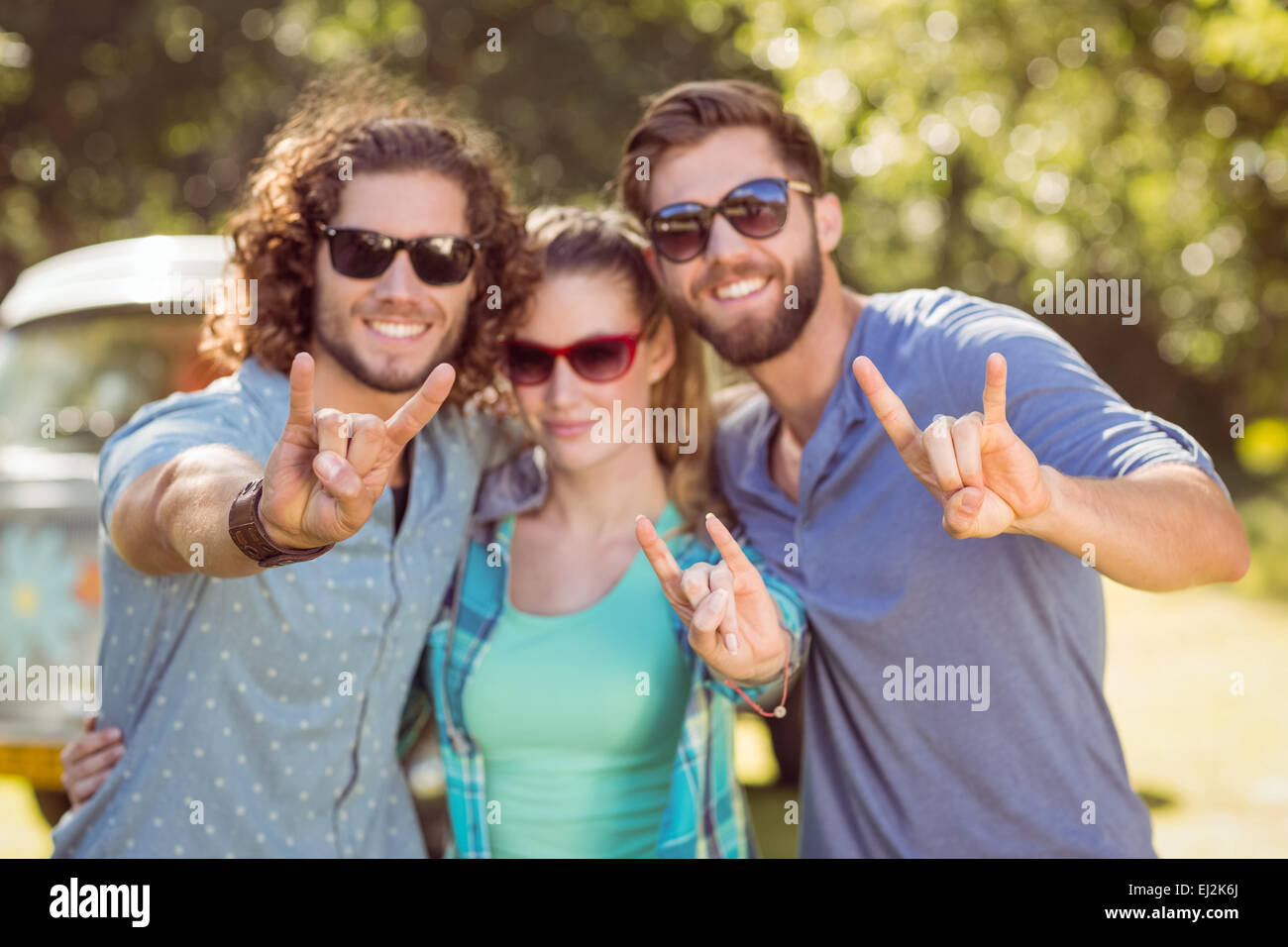 Hipster friends smiling at camera Stock Photo - Alamy