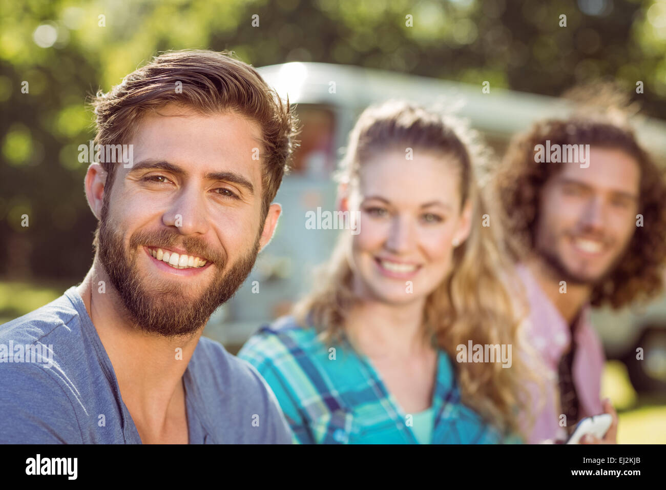 Woman texting sitting on park hi-res stock photography and images - Alamy
