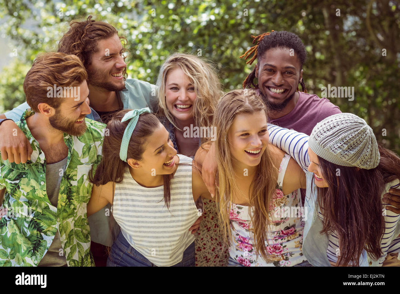 Happy friends smiling at camera Stock Photo - Alamy