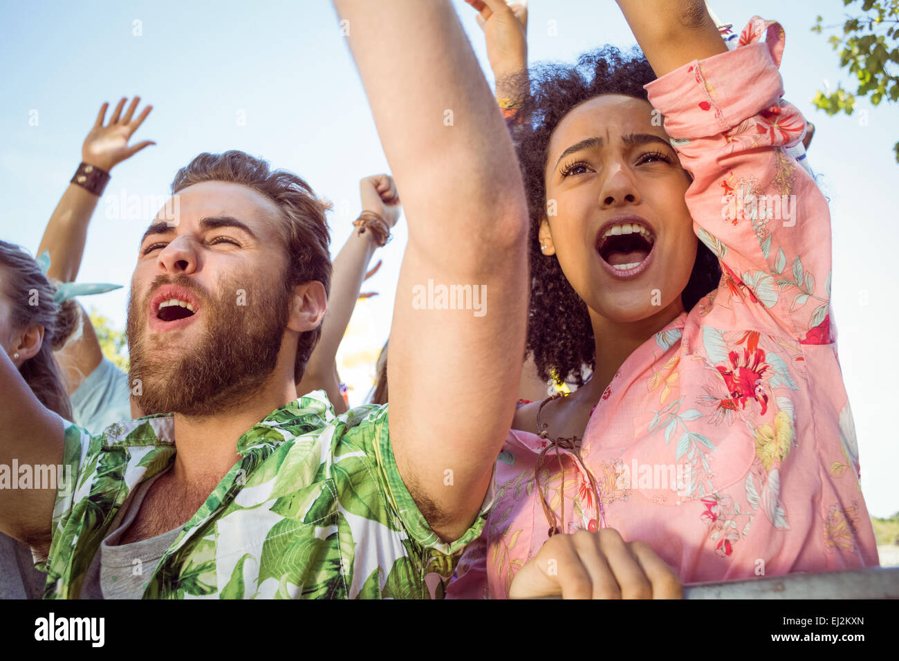 Excited young people singing along Stock Photo - Alamy