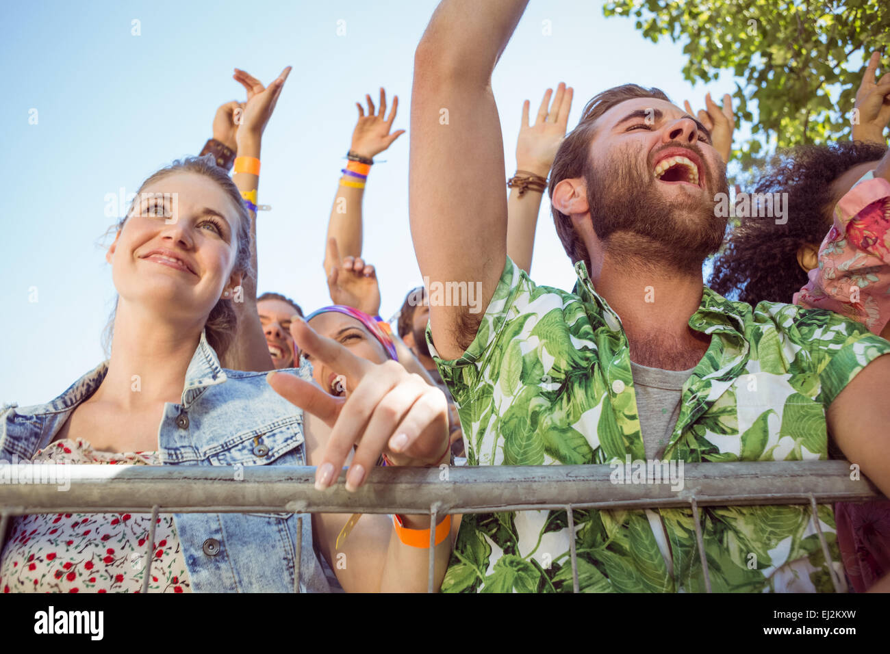 Excited young people singing along Stock Photo - Alamy