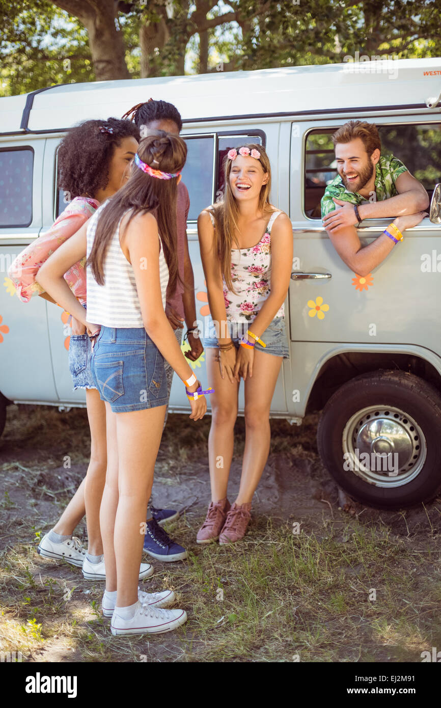 Hipsters hanging out by camper van Stock Photo - Alamy