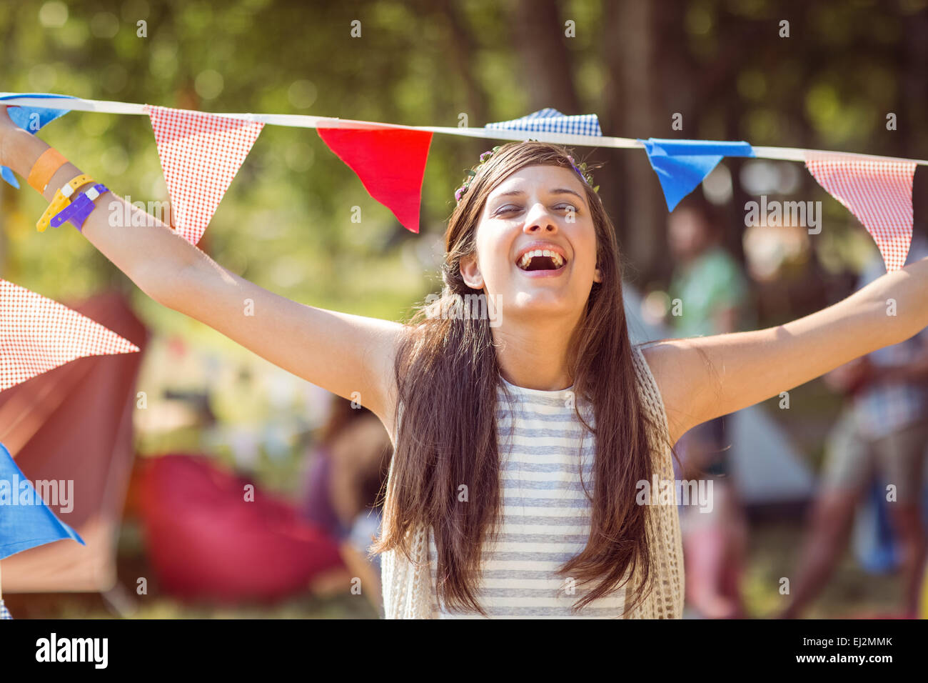 Pretty hipster posing for camera with flags Stock Photo - Alamy