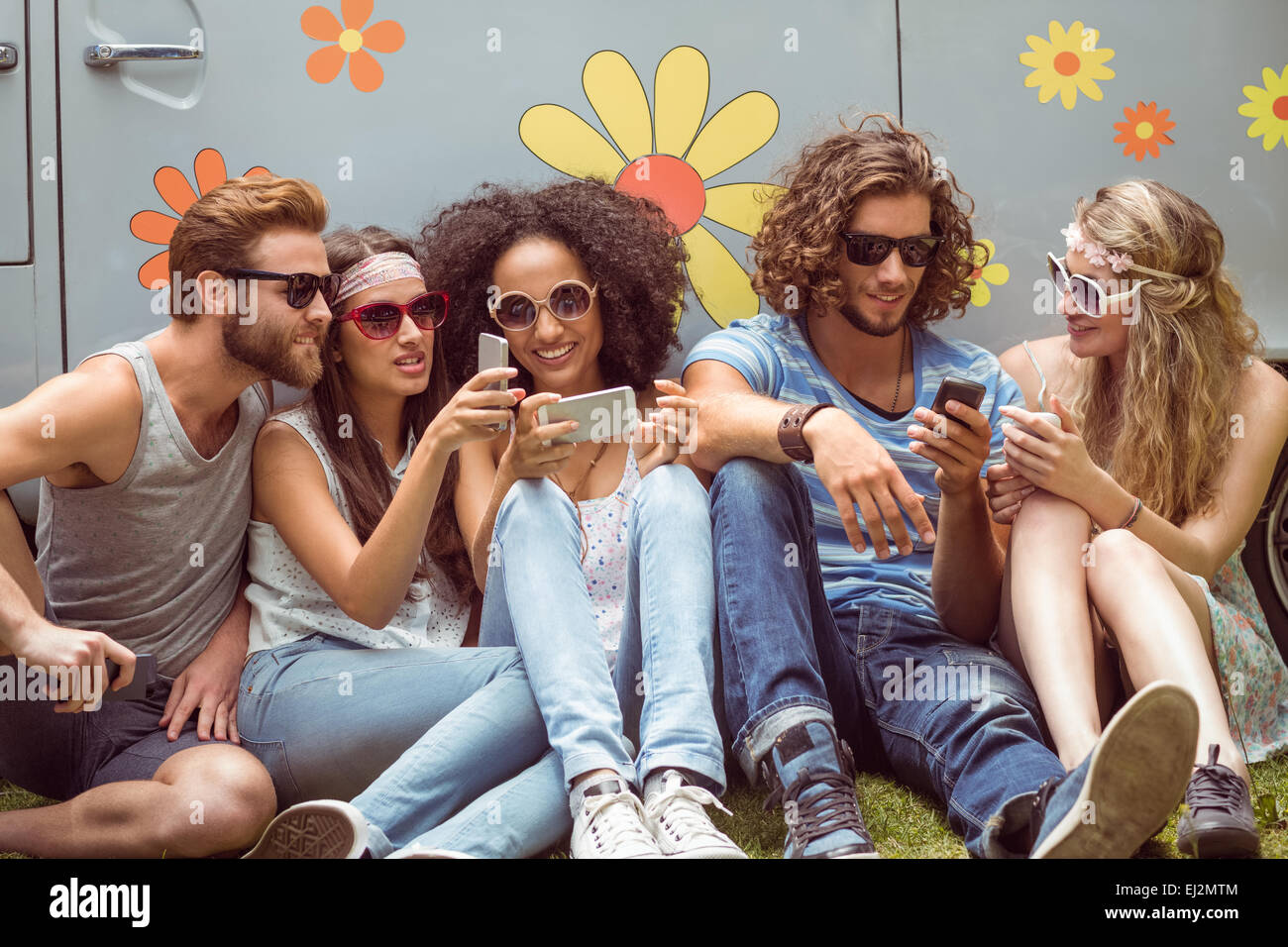 Female friends using mobile phones hi-res stock photography and images ...