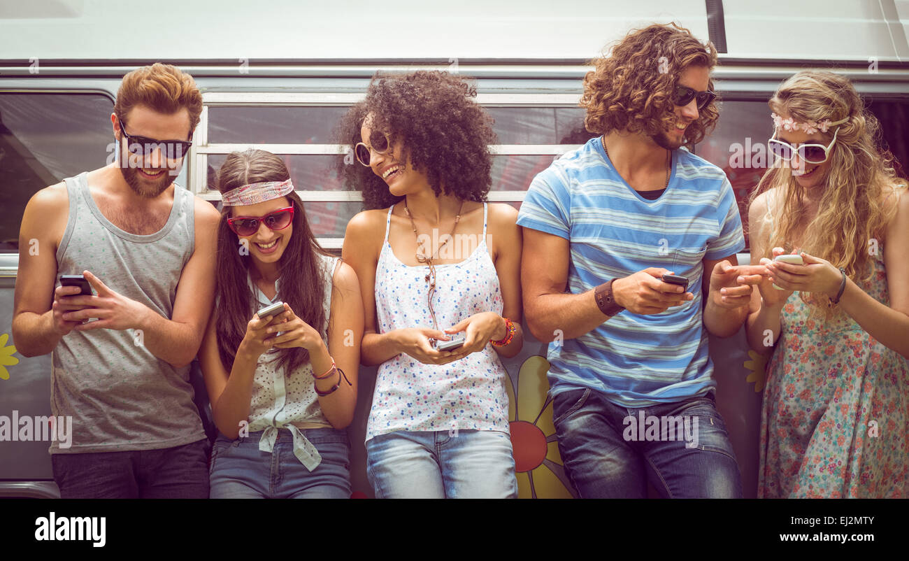 Female friends using mobile phones hi-res stock photography and images ...