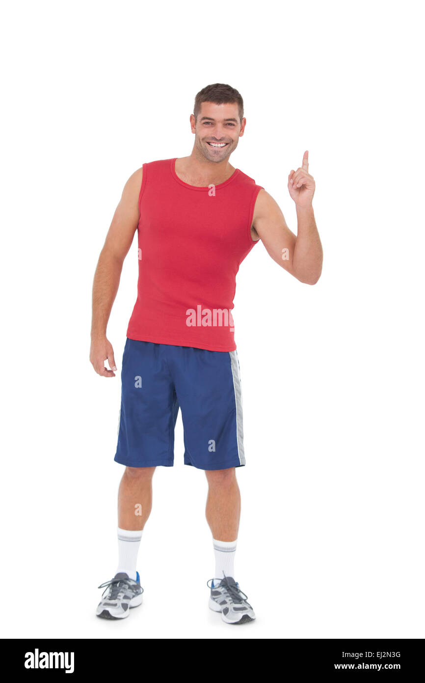 Fit man smiling and pointing Stock Photo - Alamy