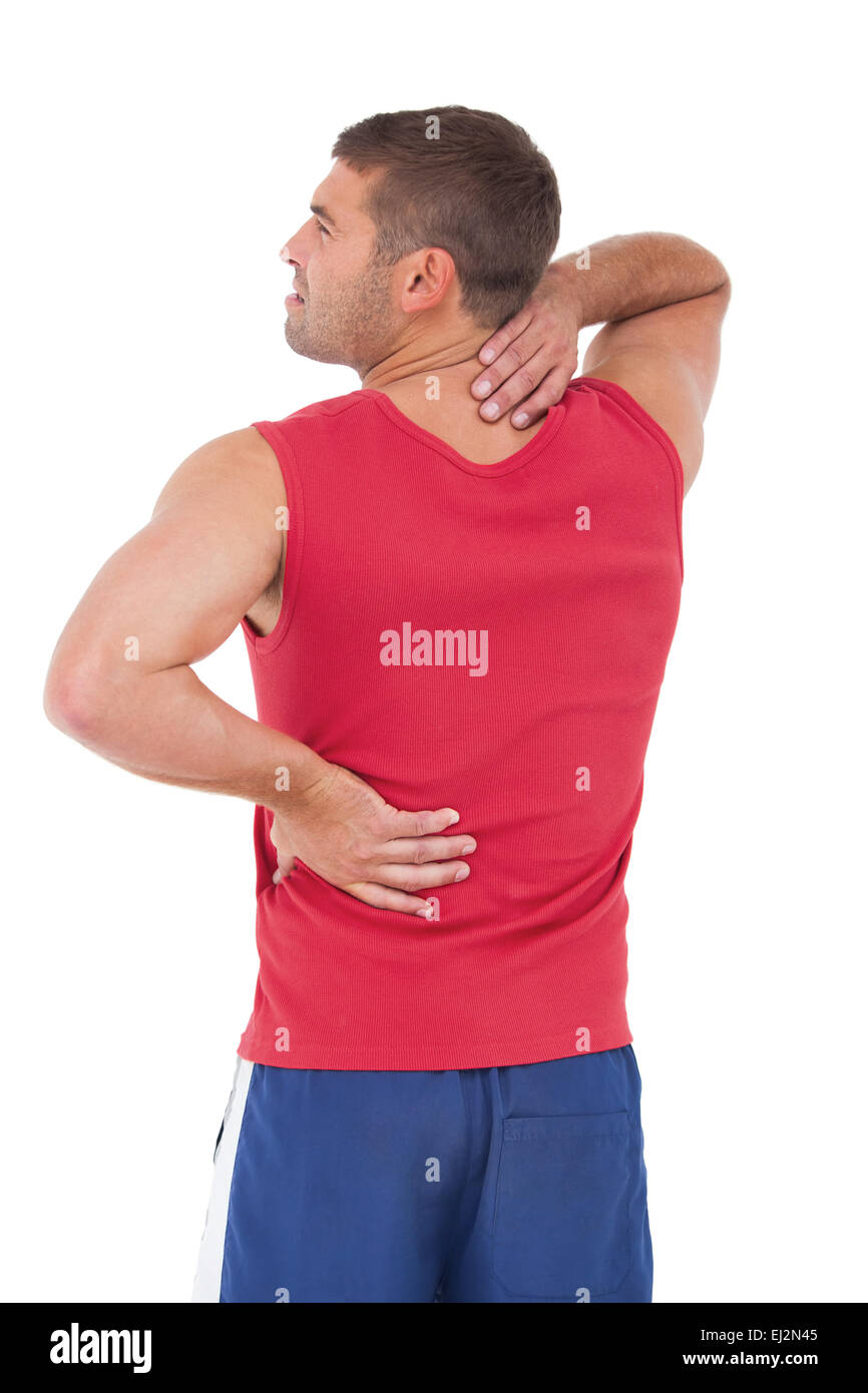 Fit man with injured back Stock Photo - Alamy