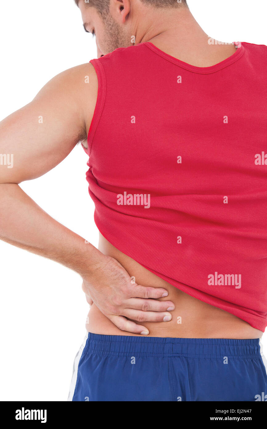 Fit man with injured back Stock Photo - Alamy