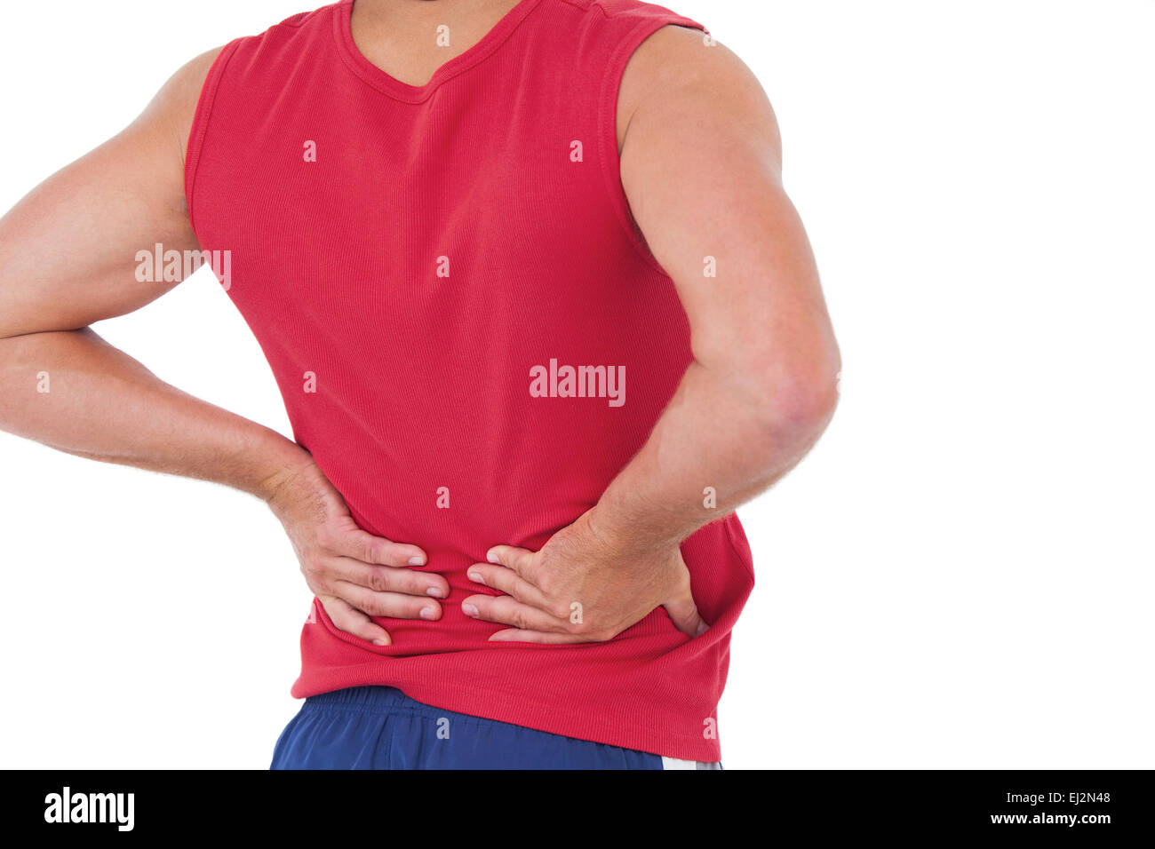Fit man with injured back Stock Photo - Alamy