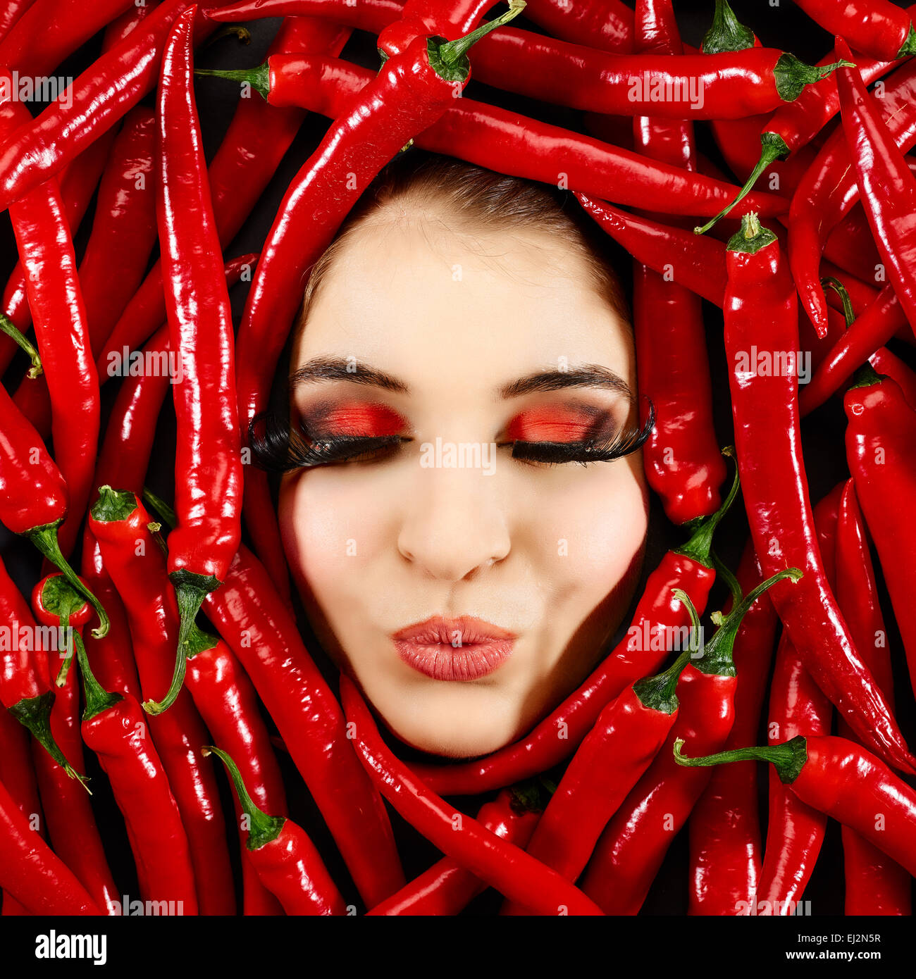 Beautiful woman expression face with red chili pepper frame Stock Photo ...