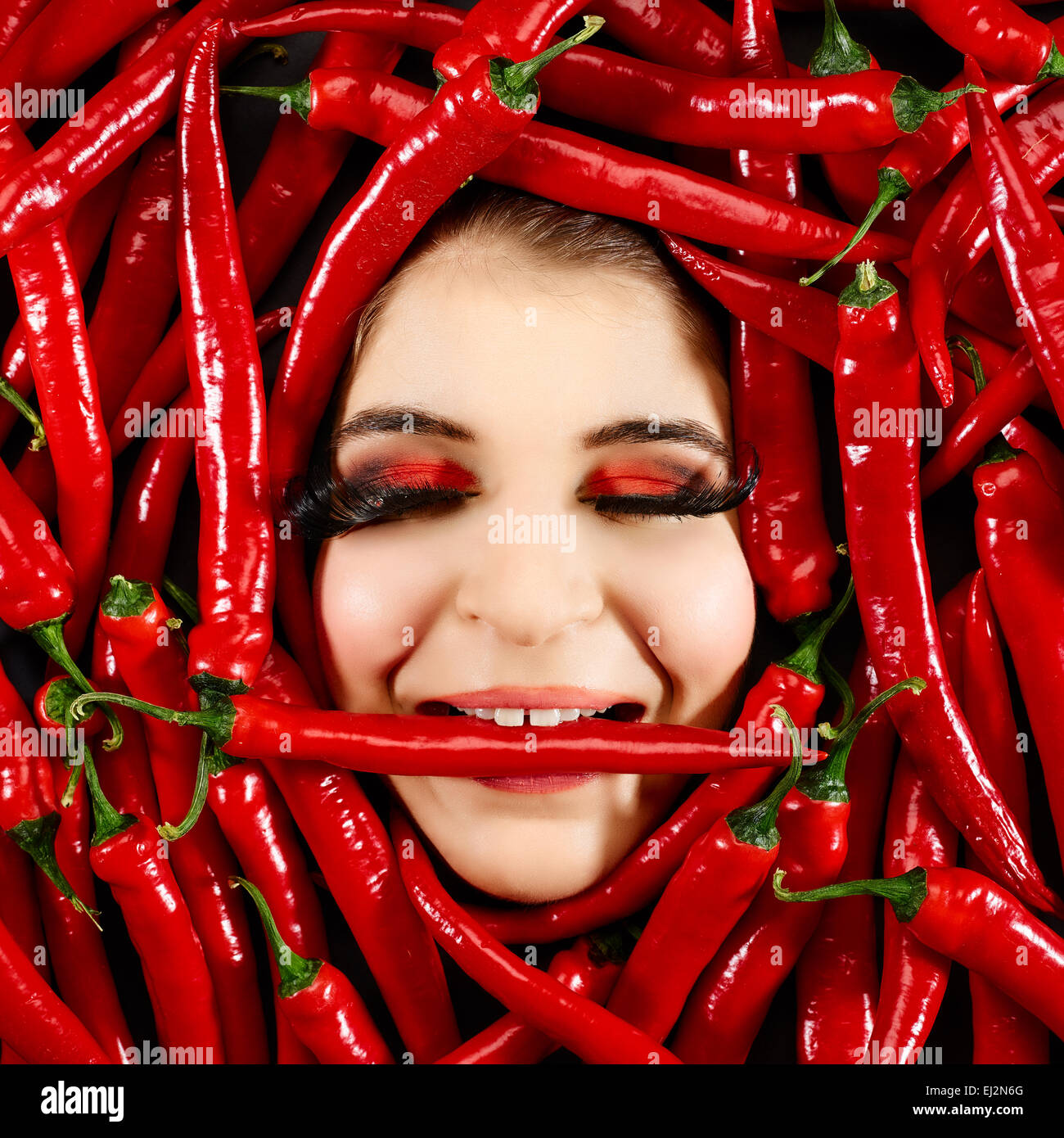 Beautiful woman expression face with red chili pepper frame Stock Photo ...