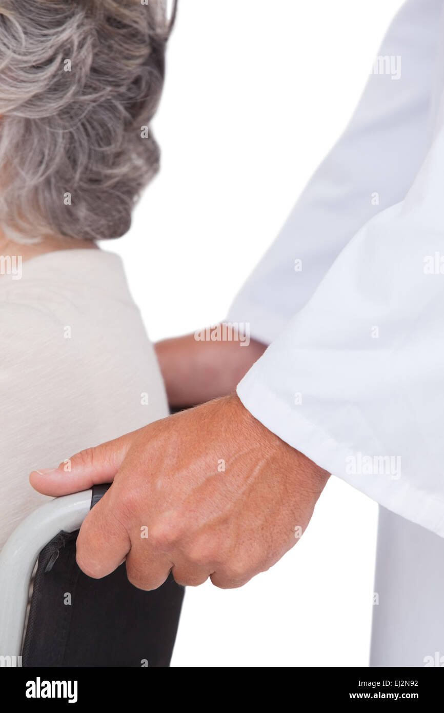Doctor pushing wheelchair hi-res stock photography and images - Alamy