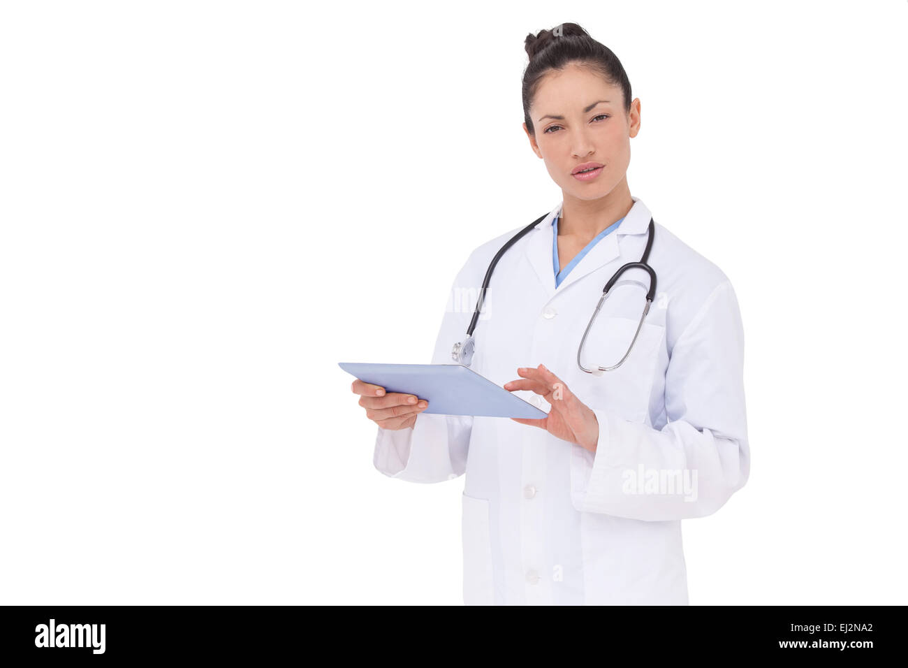 Focused doctor using her tablet pc Stock Photo - Alamy