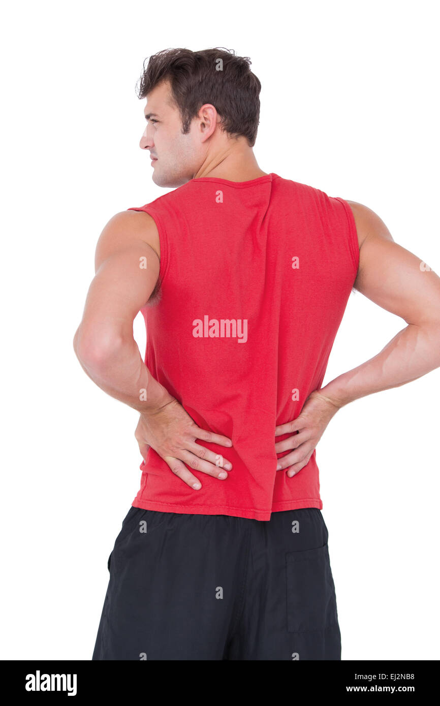 Fit man with injured back Stock Photo - Alamy