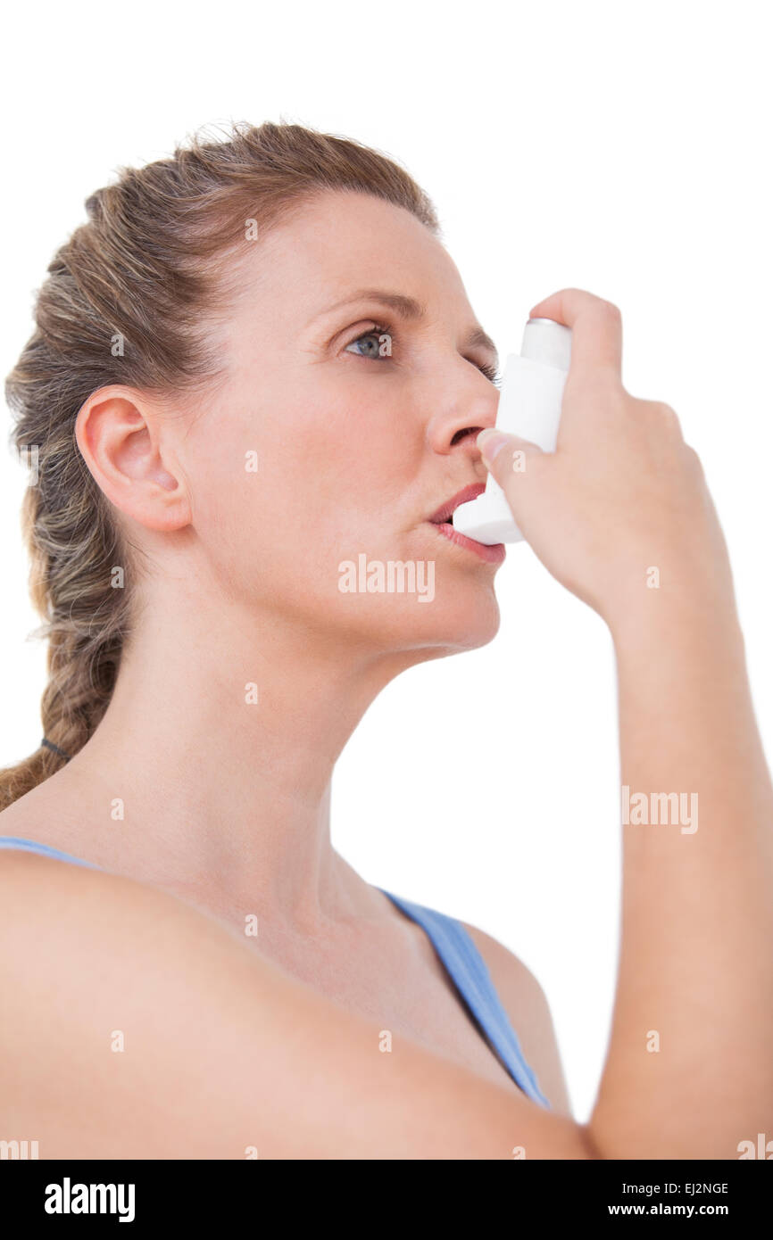 Woman using inhaler for asthma Stock Photo - Alamy