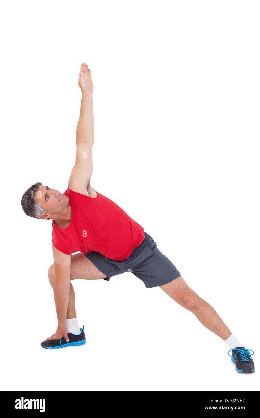 Fit man stretching his legs and arms Stock Photo - Alamy