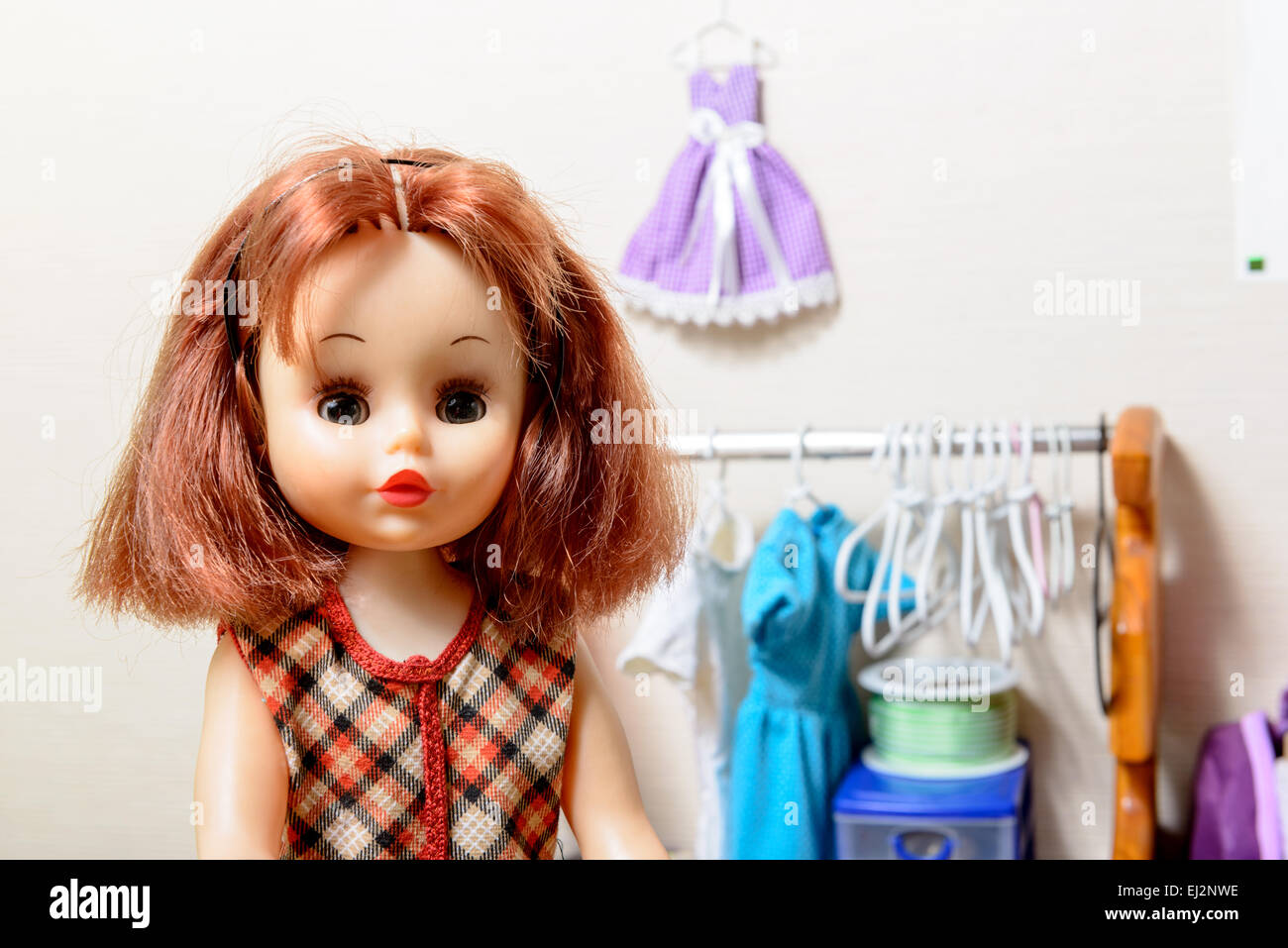 doll with red hair and several dress Stock Photo - Alamy