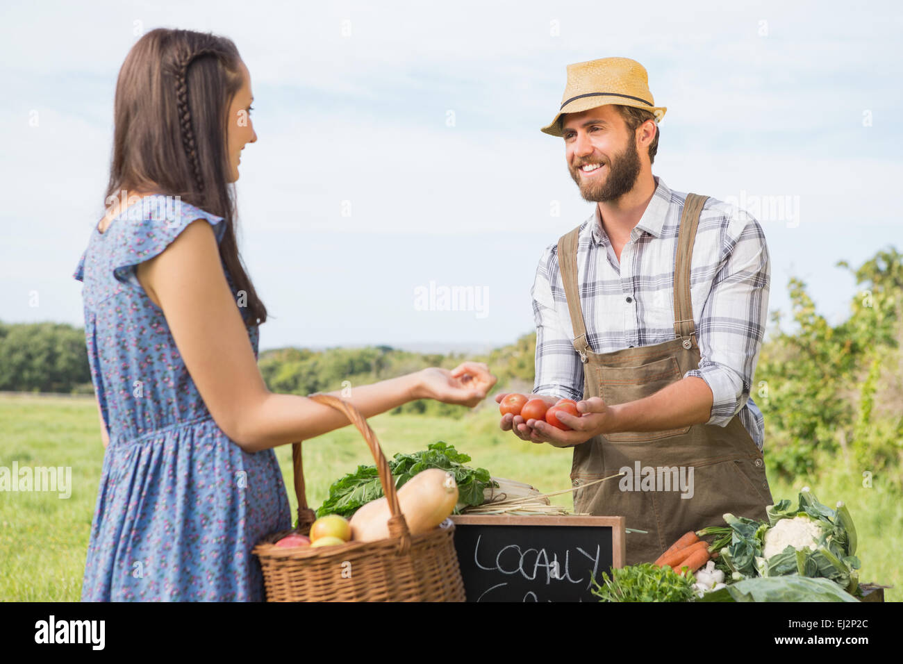 Farmer selling his organic produce Stock Photo - Alamy