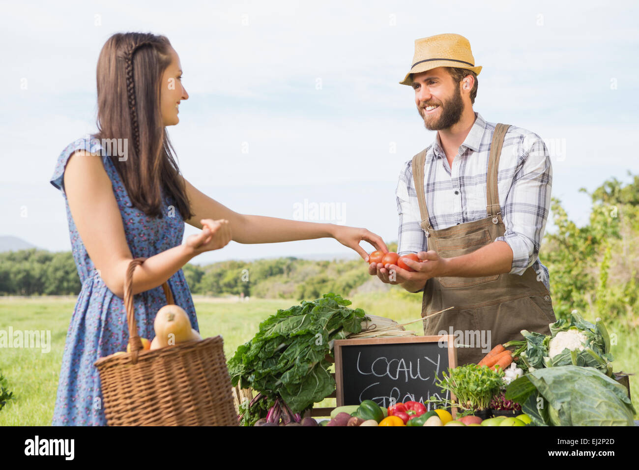 Farmer selling his organic produce Stock Photo - Alamy