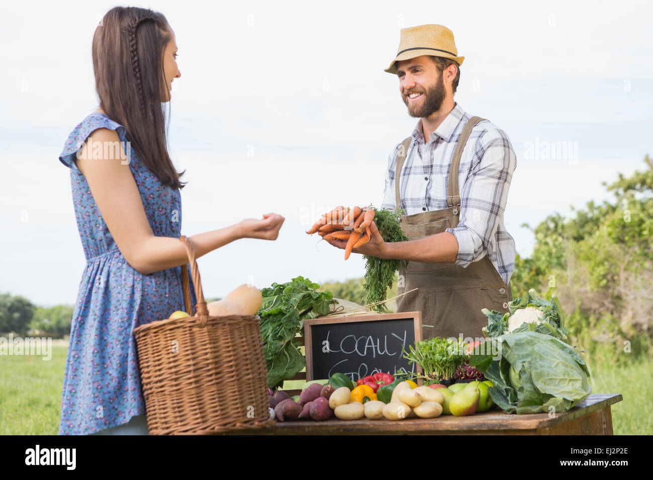 Farmer selling his organic produce Stock Photo - Alamy