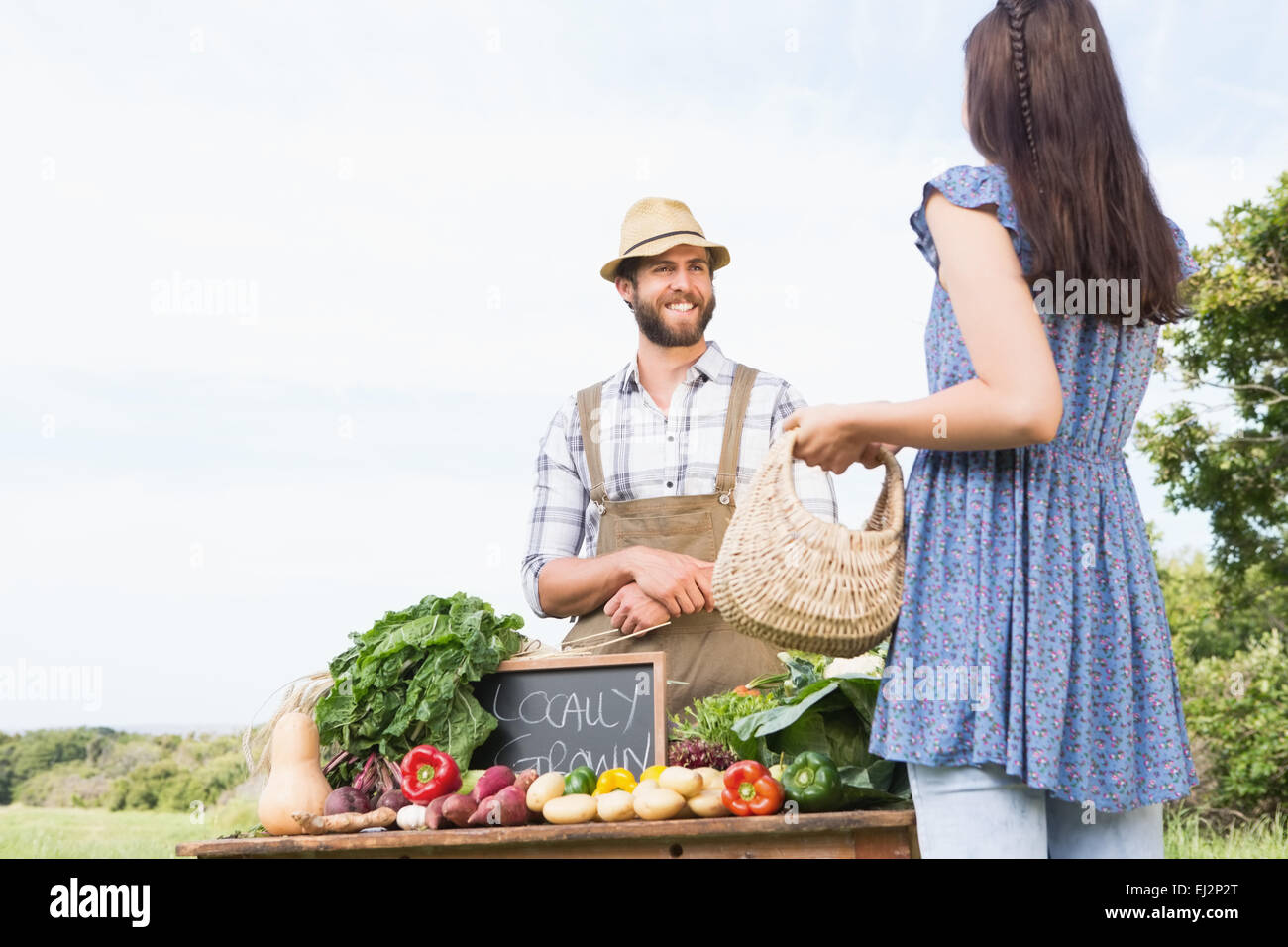 Farmer selling his organic produce Stock Photo - Alamy