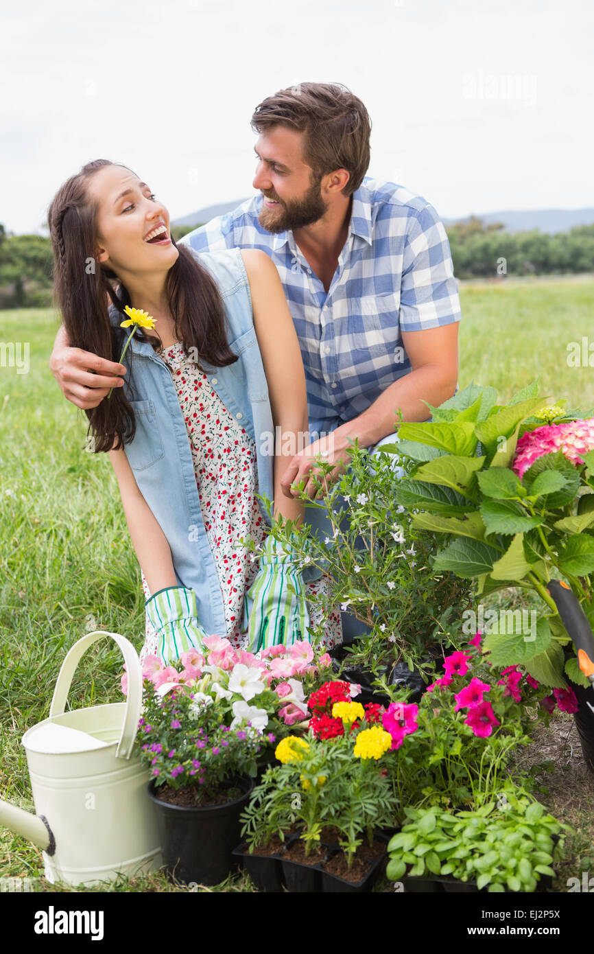 Happy young couple gardening together Stock Photo - Alamy