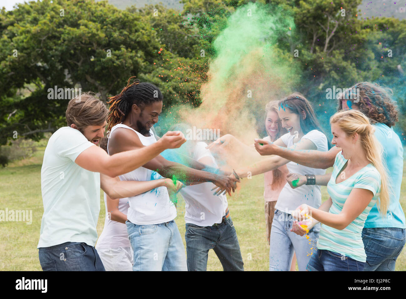 Friends having fun with powder paint Stock Photo - Alamy