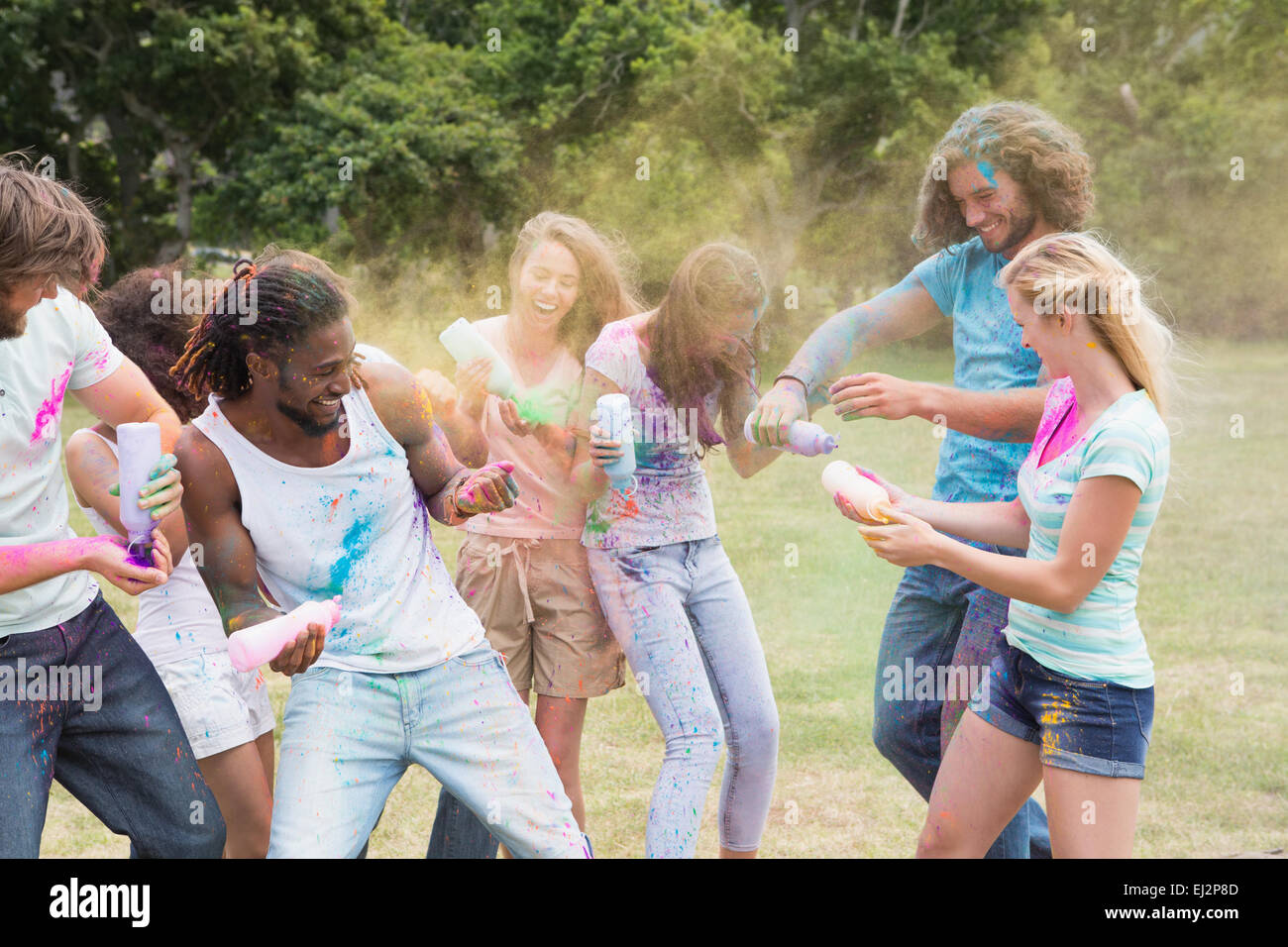 Friends having fun with powder paint Stock Photo - Alamy