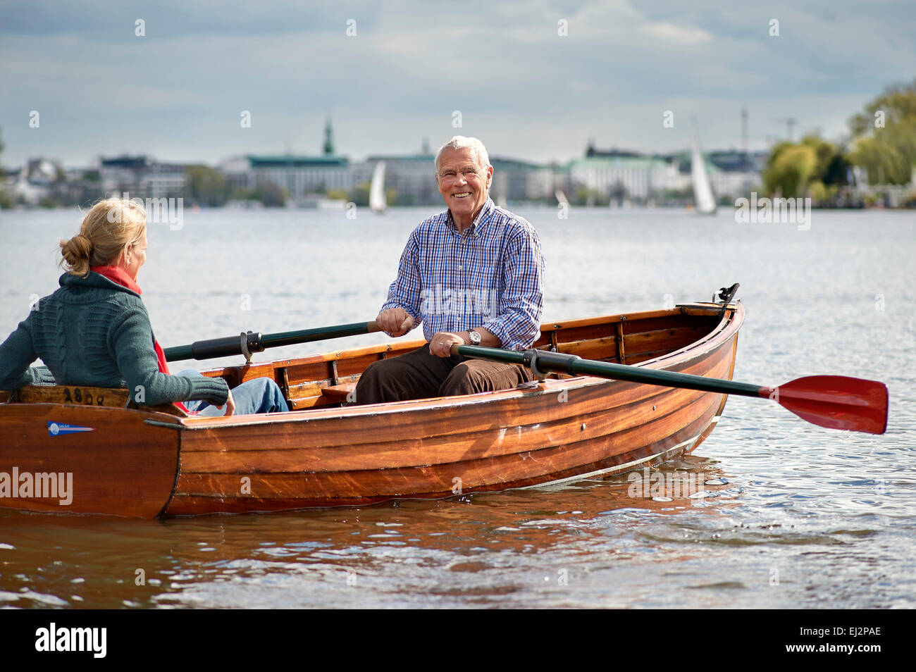 Elderly man rowing a boat hi-res stock photography and images - Alamy