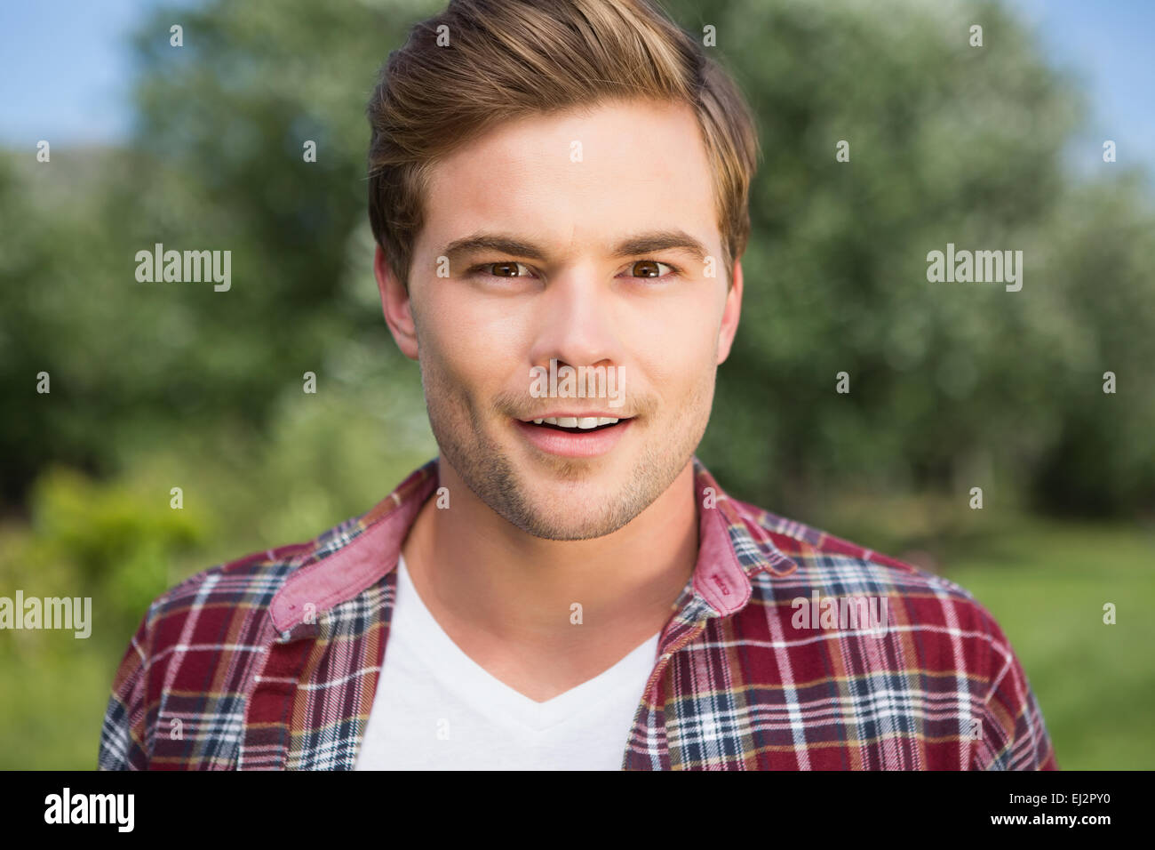 Handsome hipster smiling at camera Stock Photo - Alamy