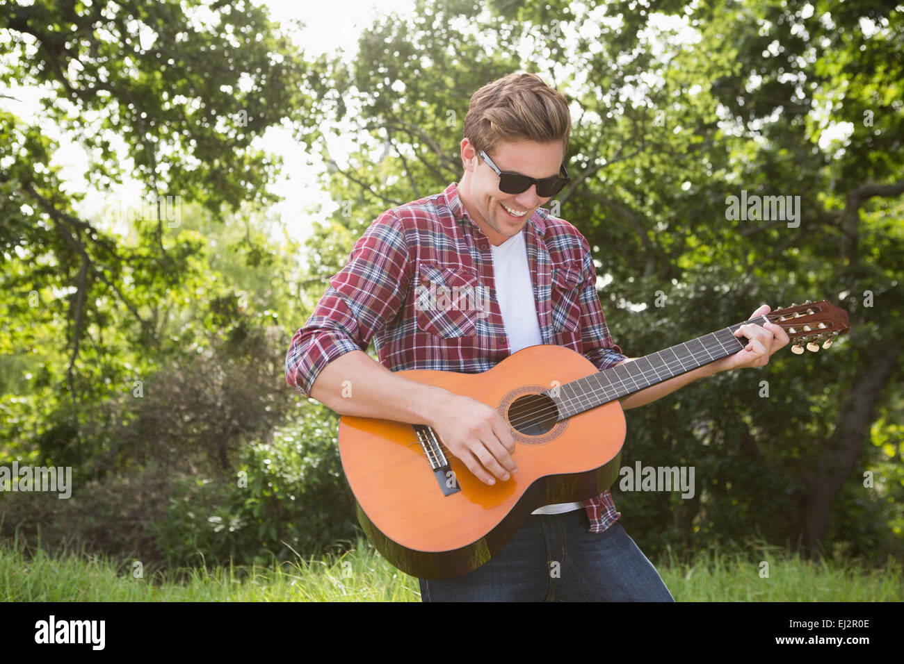 Young handsome man singing guitar hi-res stock photography and images ...