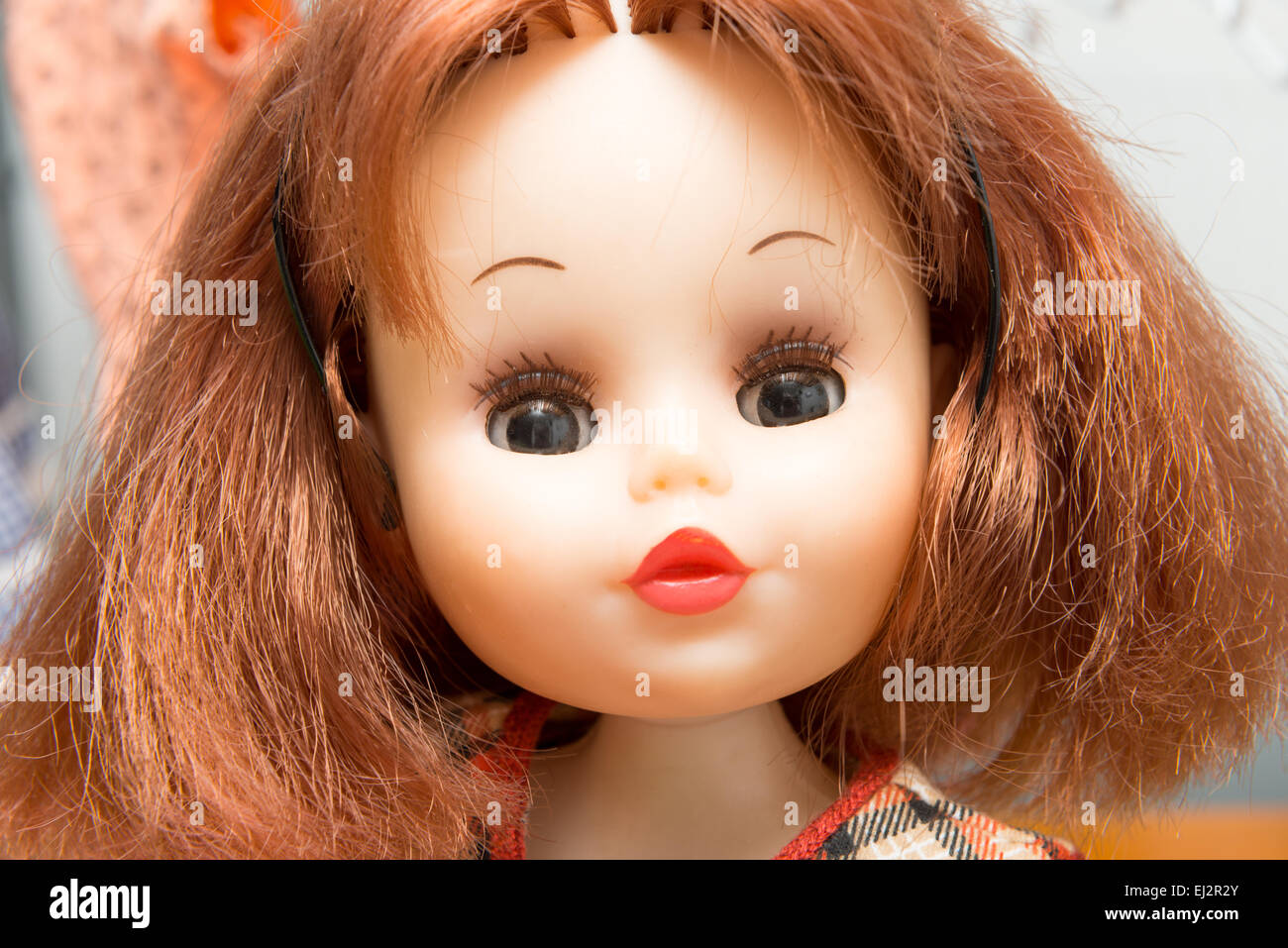 close up of the face of a doll with red hair Stock Photo - Alamy