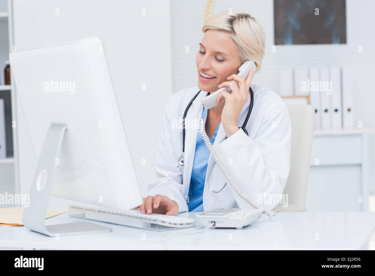 Young smart female doctor computer hi-res stock photography and images ...