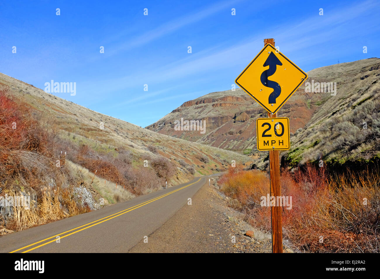 A warning sign on a curvy mountain road in north central oregon Stock ...