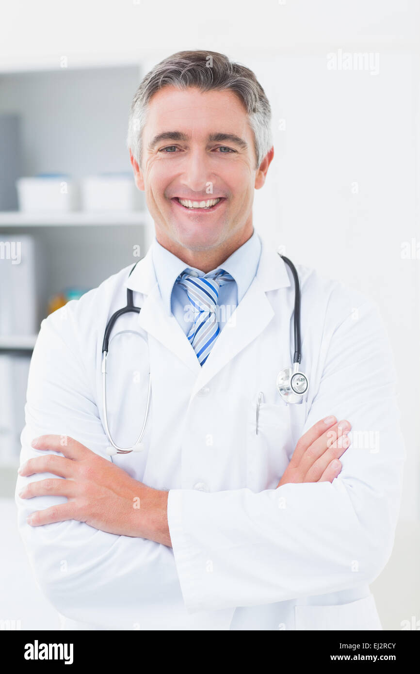 Confident doctor with arms crossed in clinic Stock Photo - Alamy