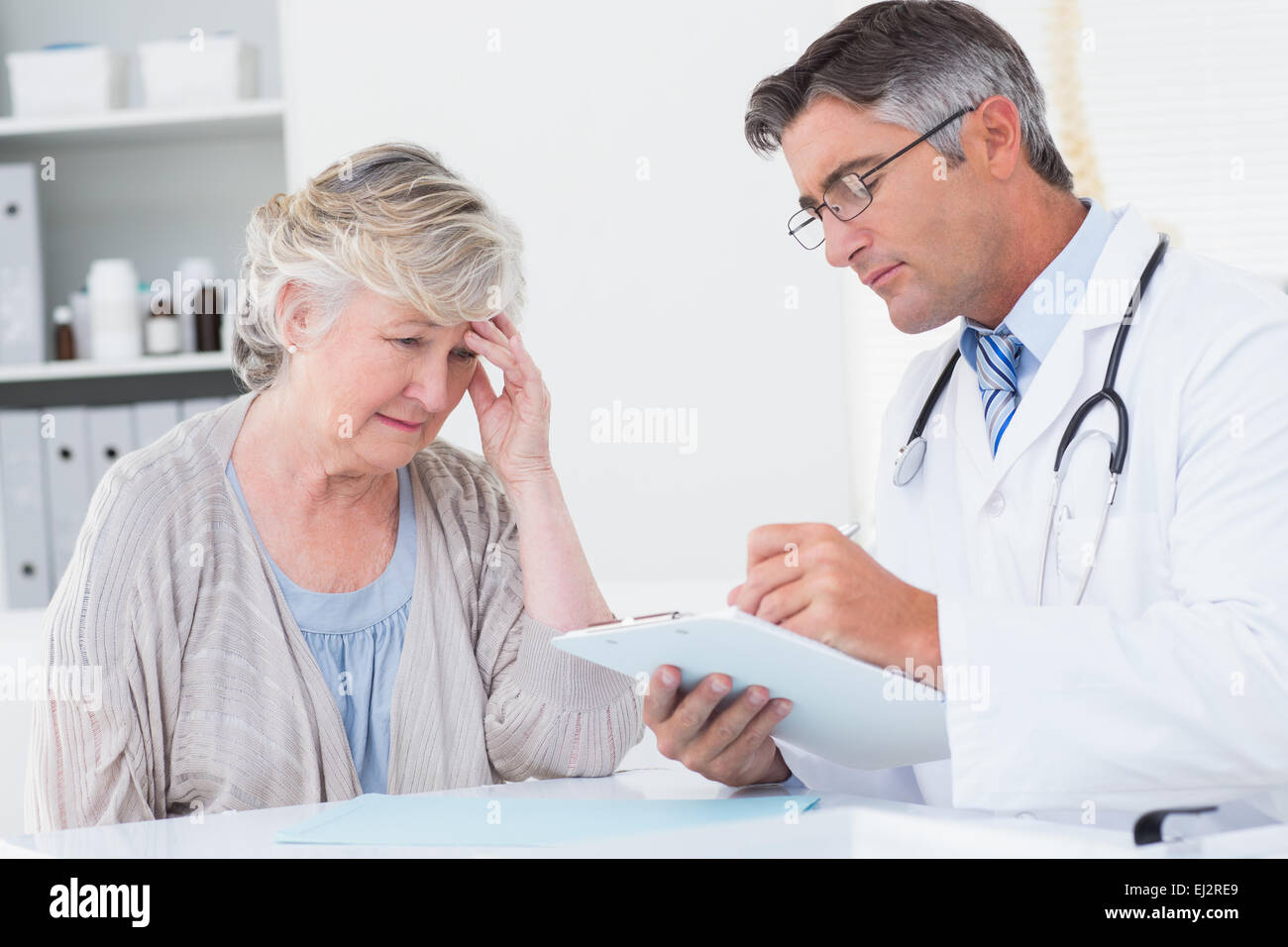 Doctor explaining prescription to senior patient Stock Photo - Alamy