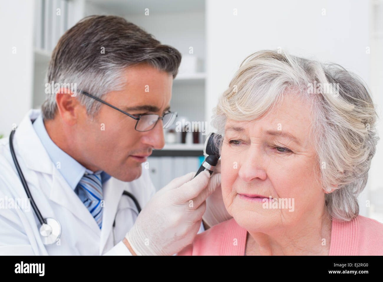 Doctor ear examination hi-res stock photography and images - Alamy
