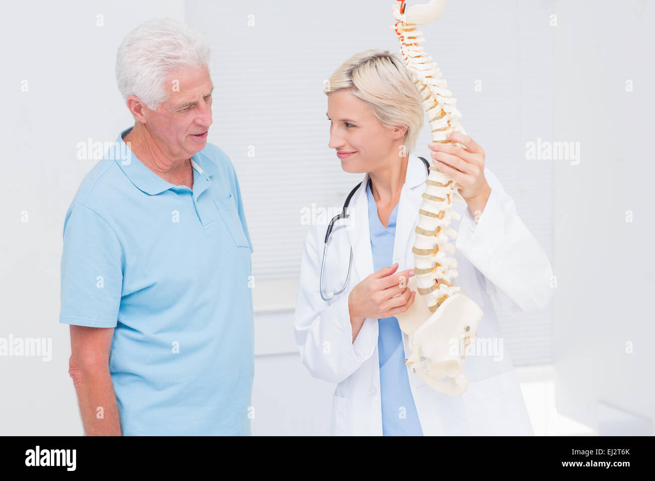 Doctor explaining anatomical model senior hi-res stock photography and ...