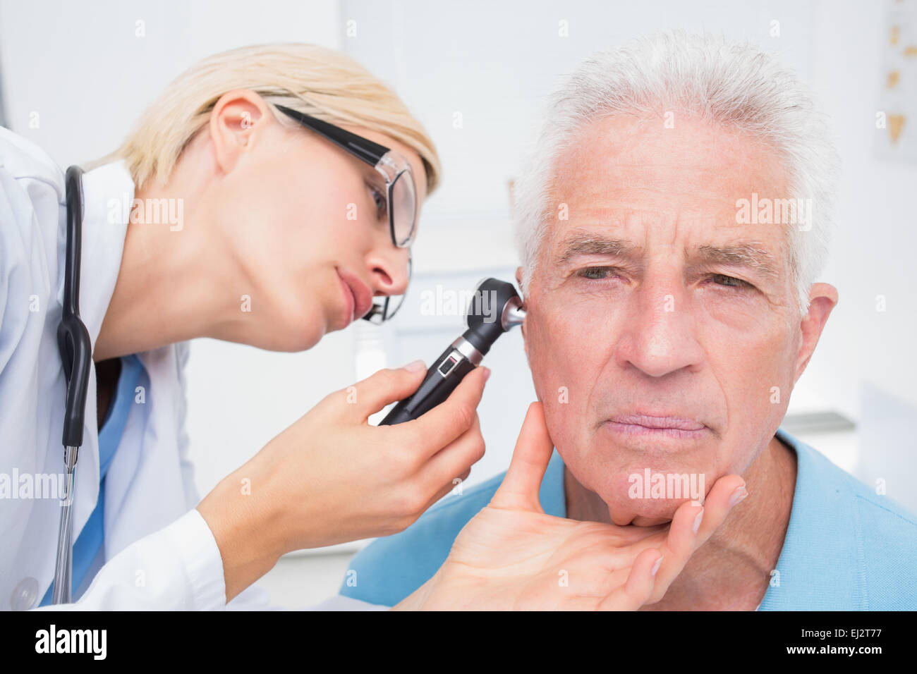 Doctor ear examination hi-res stock photography and images - Alamy