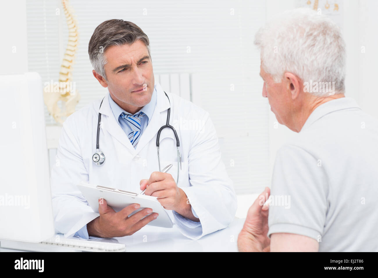 Senior patient sharing problems with doctor Stock Photo - Alamy