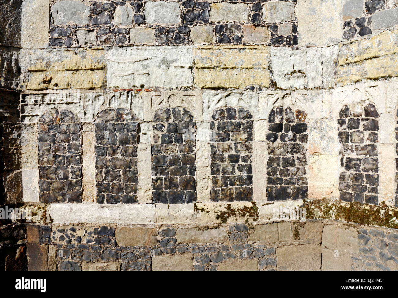 Flint flushwork at the base of the tower of the parish church at ...