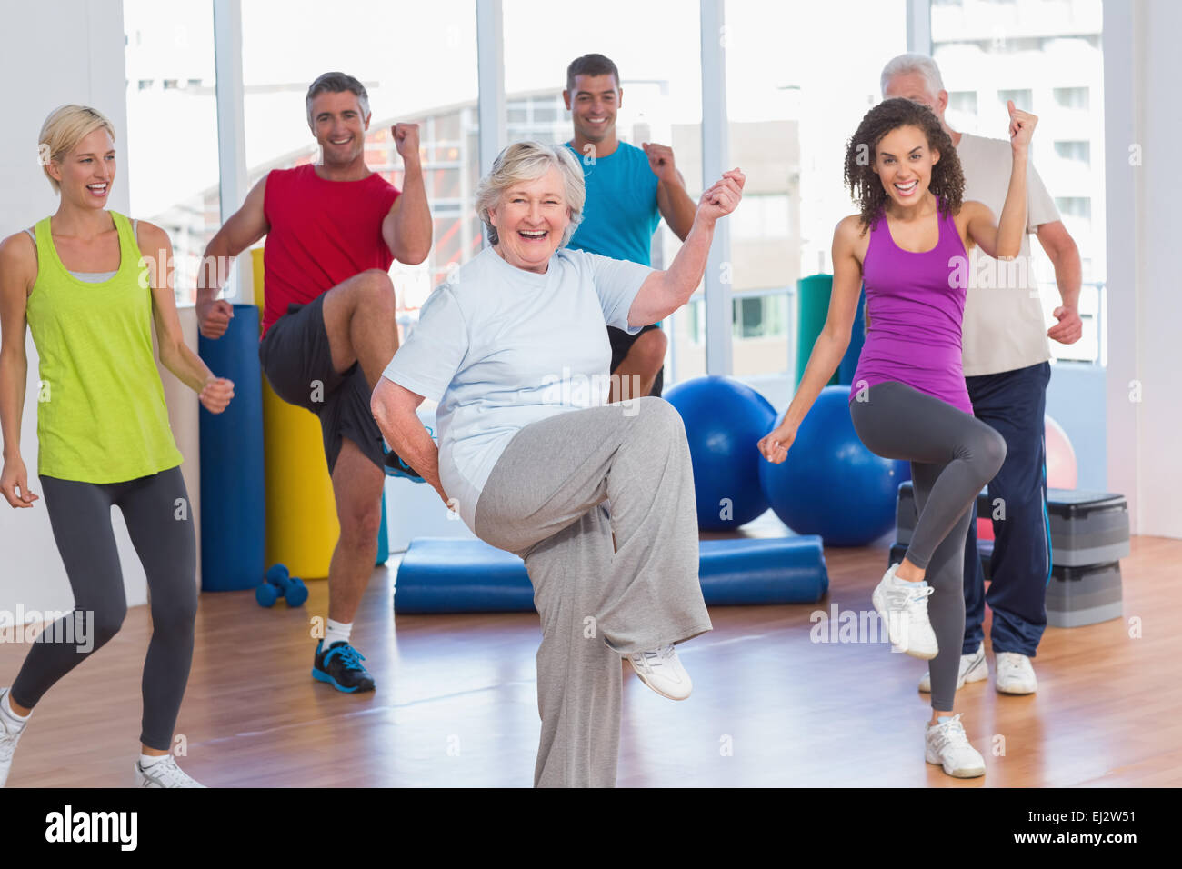 Group performing fitness exercises hi-res stock photography and images ...