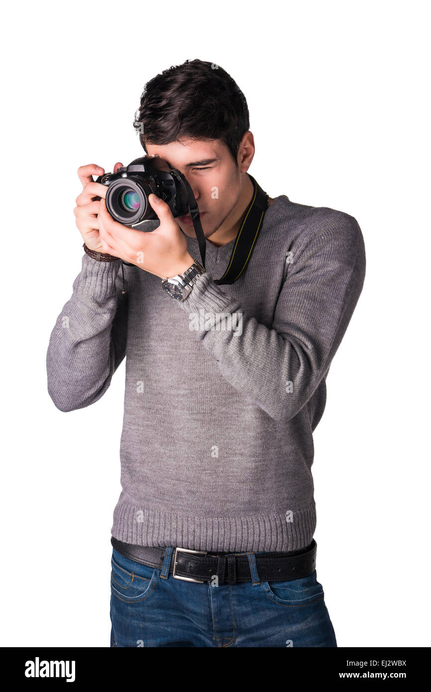 Handsome young male photographer taking photograph with professional ...