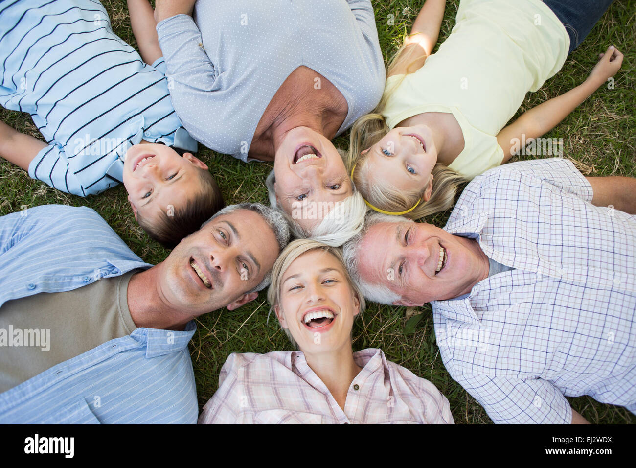 Happy family looking up the camera Stock Photo - Alamy Happy family looking up the camera Stock Photo - Alamy
