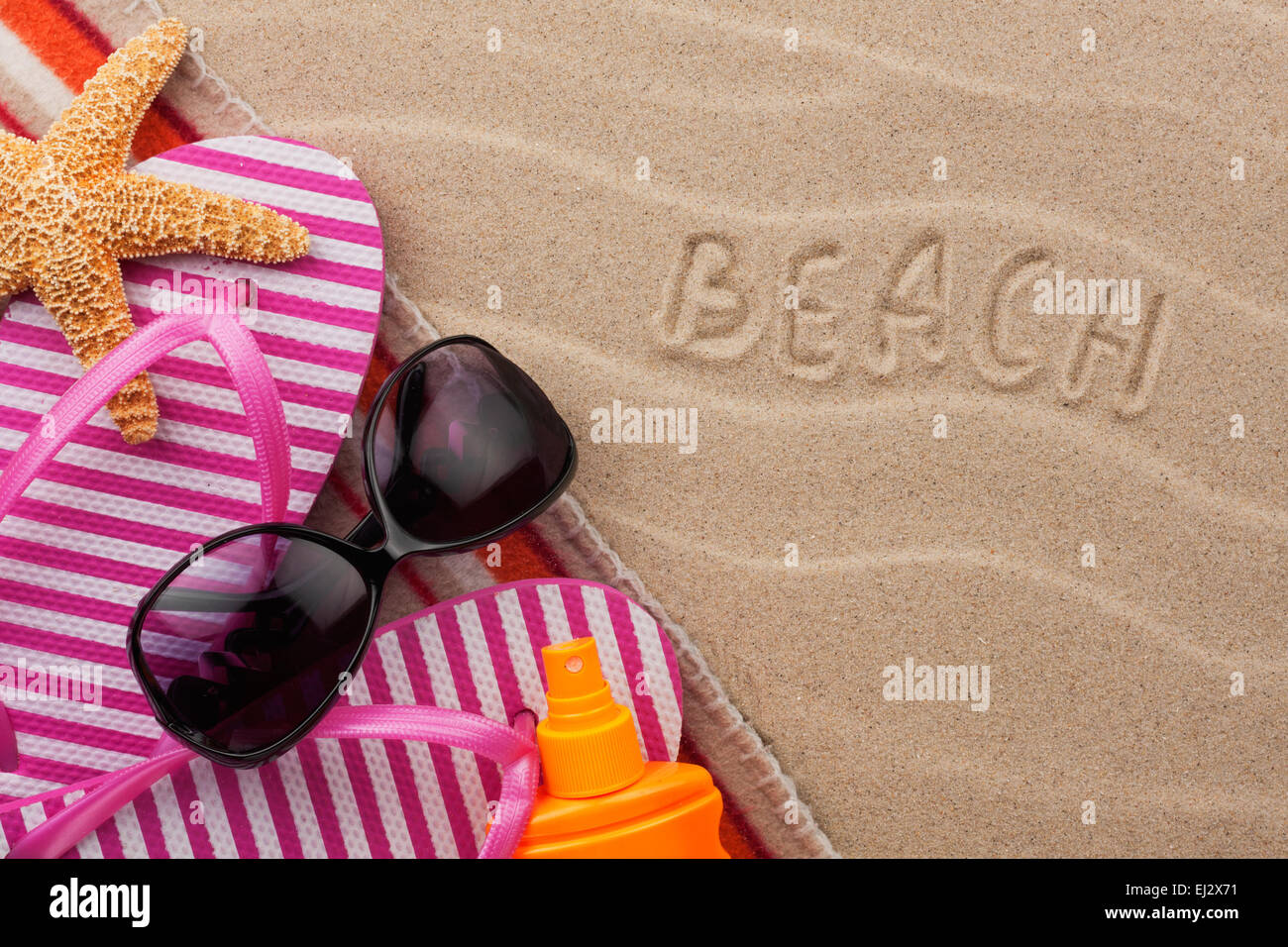 Word beach, written in the sand, beach background Stock Photo - Alamy